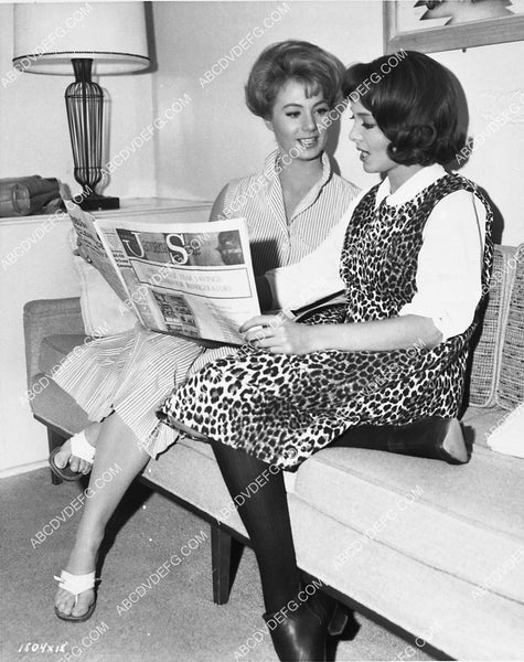 Candid Shirley Jones And Carolyn Jones Reading The Newspaper Between T