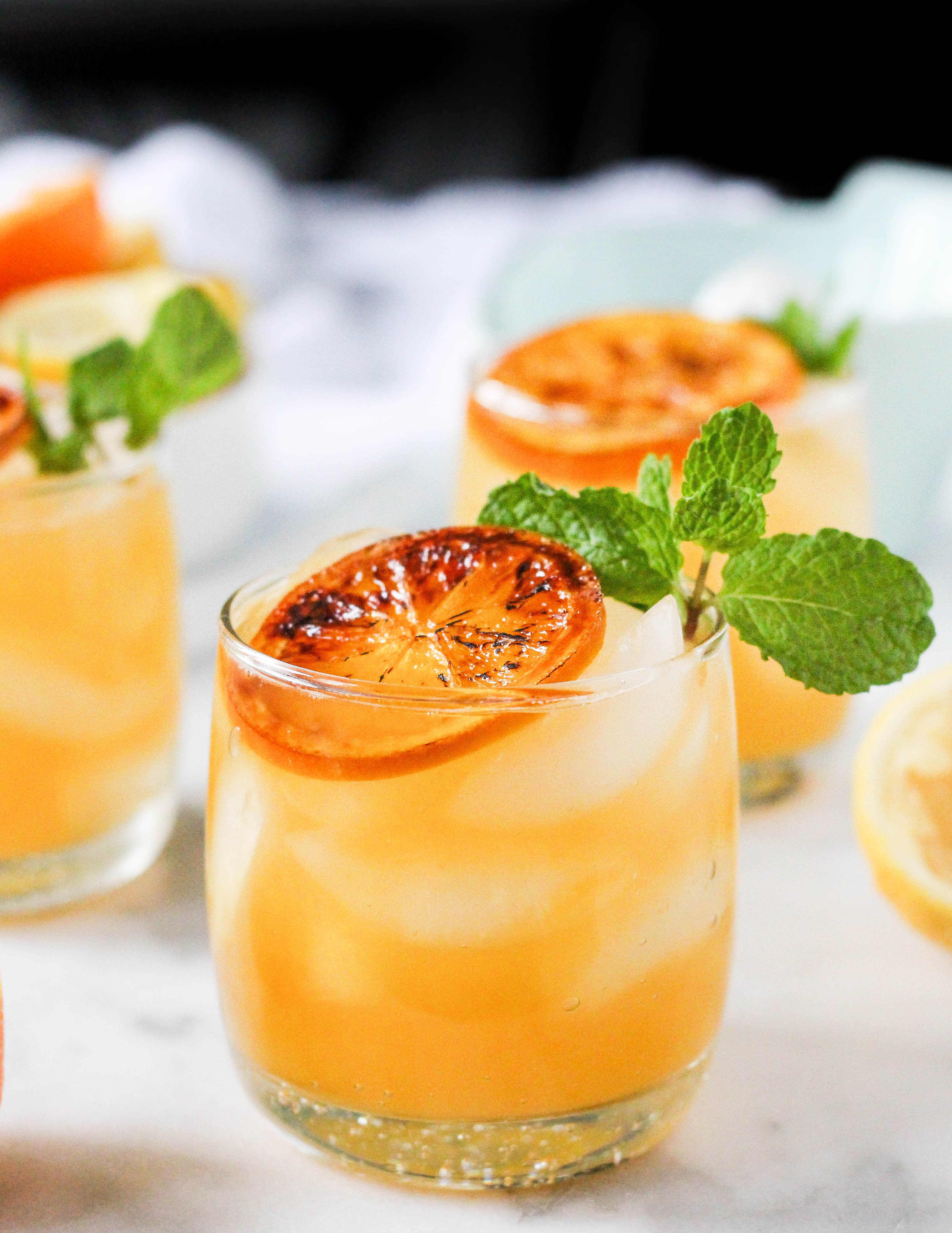 Boozy Clementine Lemonade With Brûléed Citrus And Mint