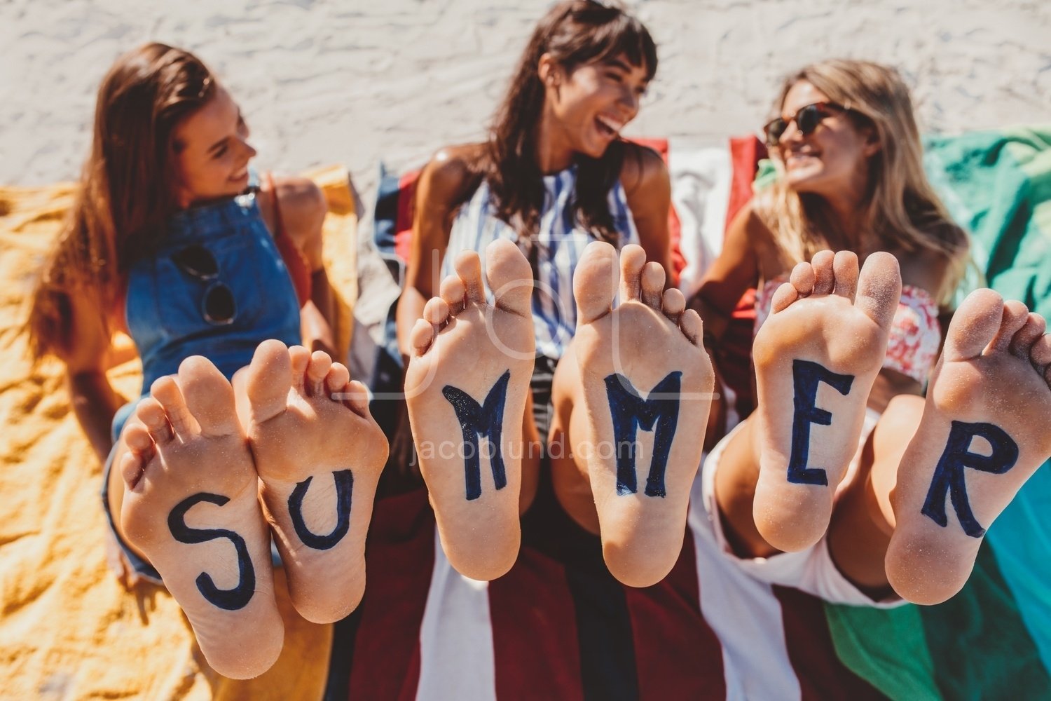 Bare Feet Of Female Friends With Word Summer Jacob Lund Photography