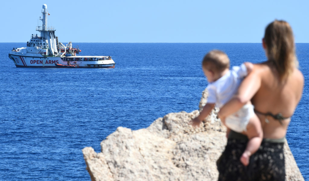 Migrants Jump Off Rescue Boat To Try To Reach Italian Island Pbs News