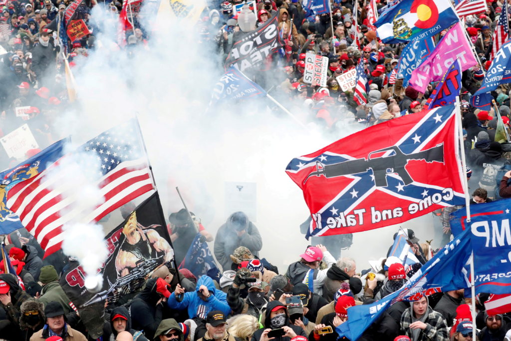 Man Who Waved Confederate Flag During Jan 6 Attack Pleads Guilty Pbs