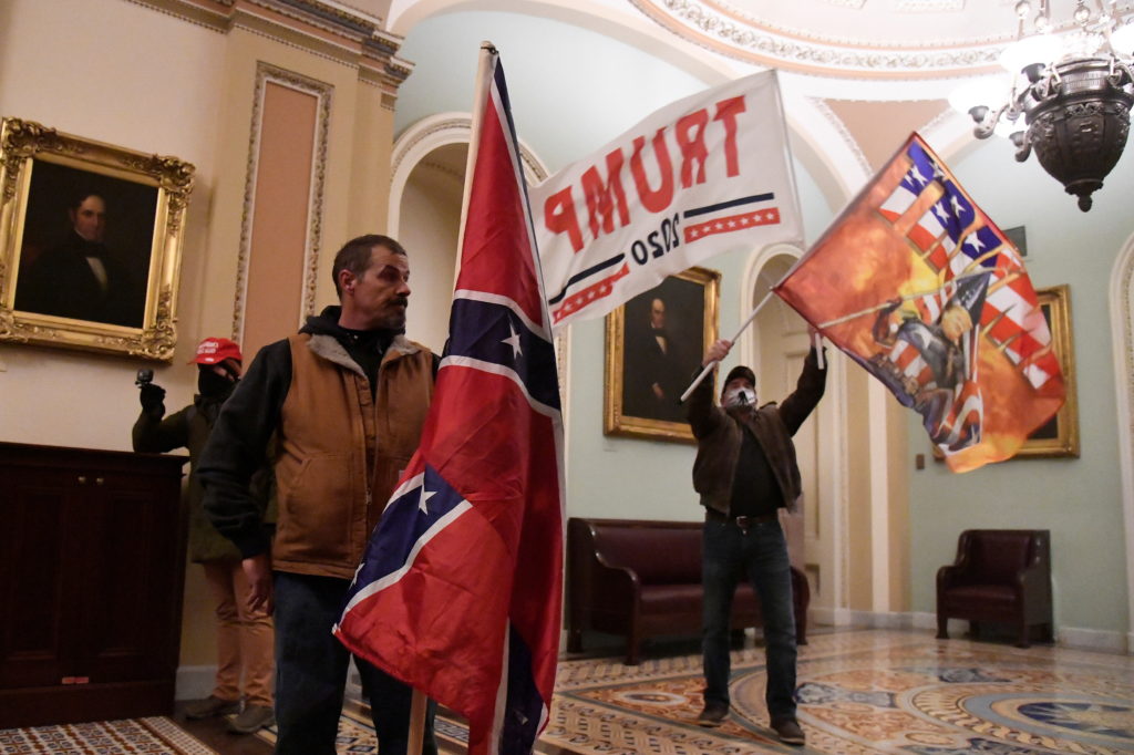 Jan 6 Participant Who Carried Confederate Flag Into Capitol Begins