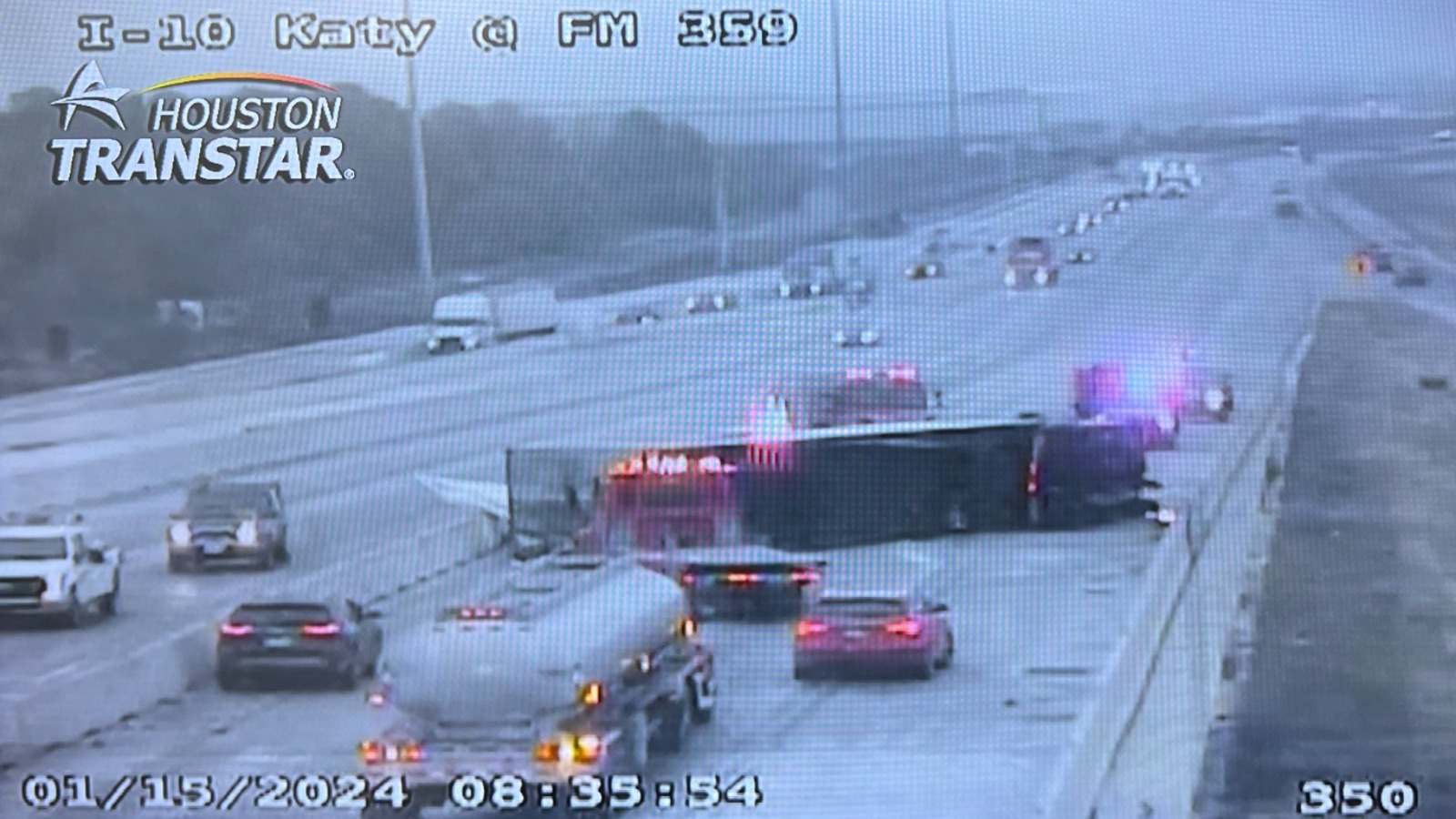 Icy Road Conditions Turn Treacherous As Semi Truck Overturns In Houston