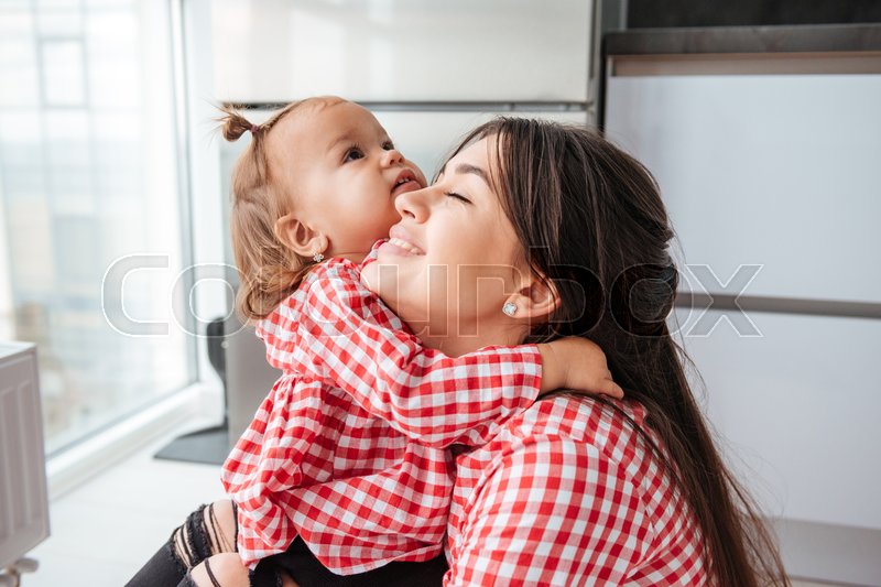 Mother Embracing With Her Daughter Stock Image Colourbox