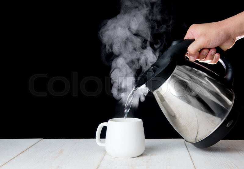 Kettle Pouring Boiling Water Into A Cup Stock Image Colourbox