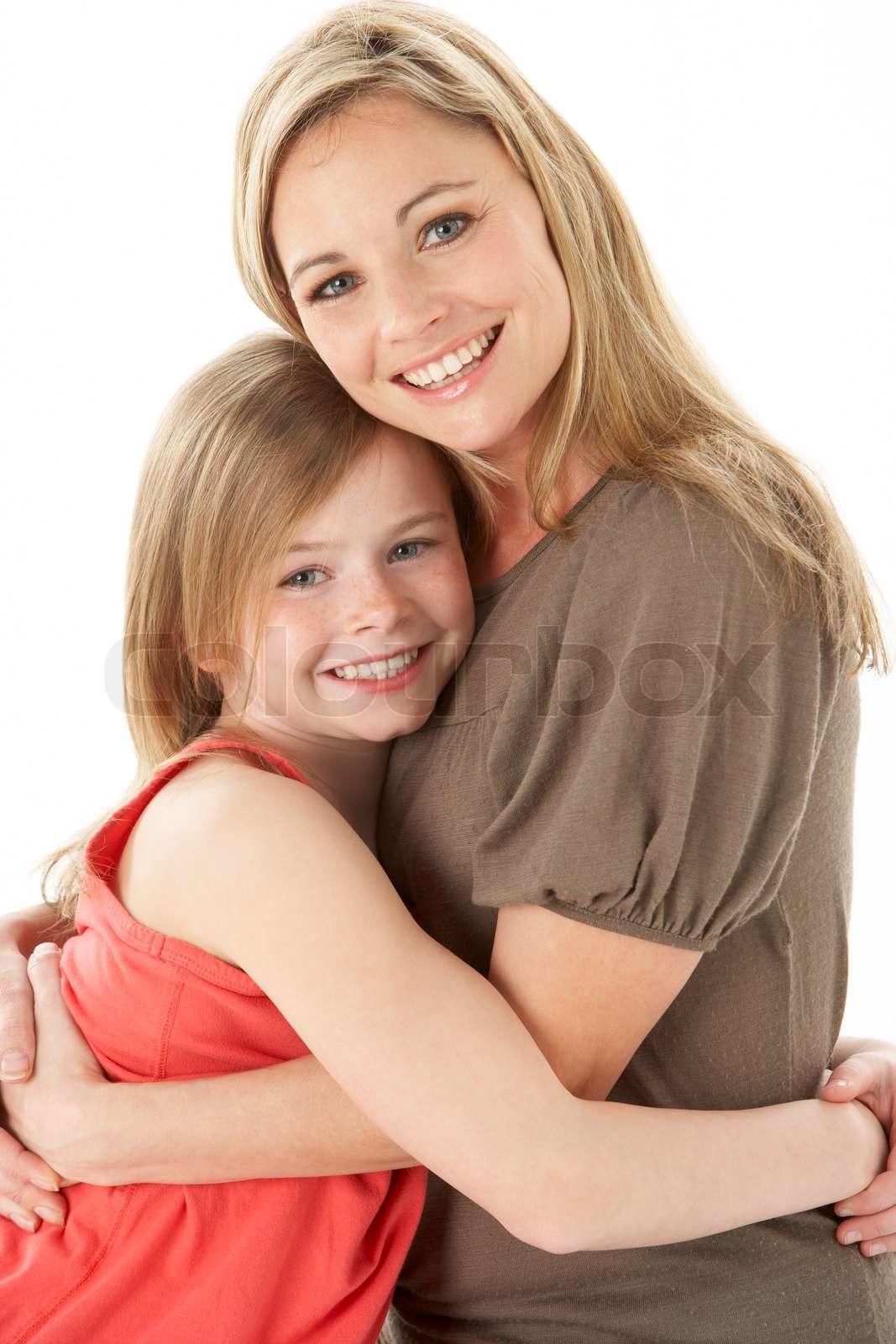 Studio Portrait Of Mother Hugging Young Daughter Stock Image Colourbox