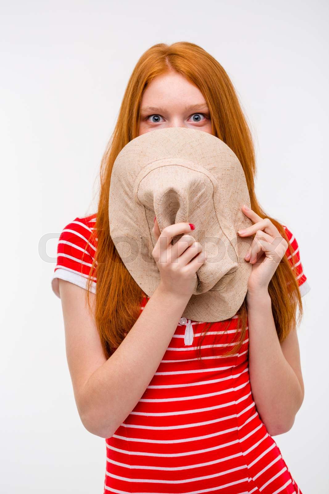 Embarrassed Shy Woman Hiding Her Face Behind Hat Stock Image Colourbox