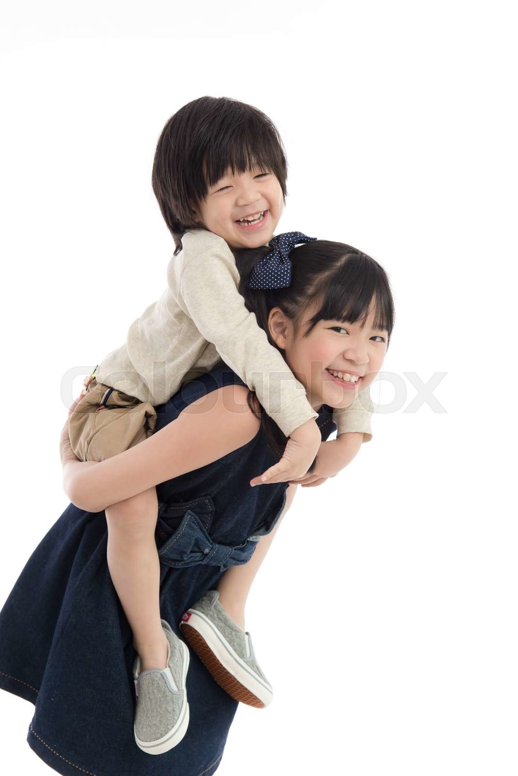 Girl Giving Her Brother Piggyback Ride Stock Image Colourbox