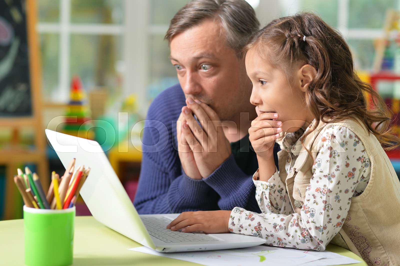 Father And Daughter With Laptop Stock Image Colourbox