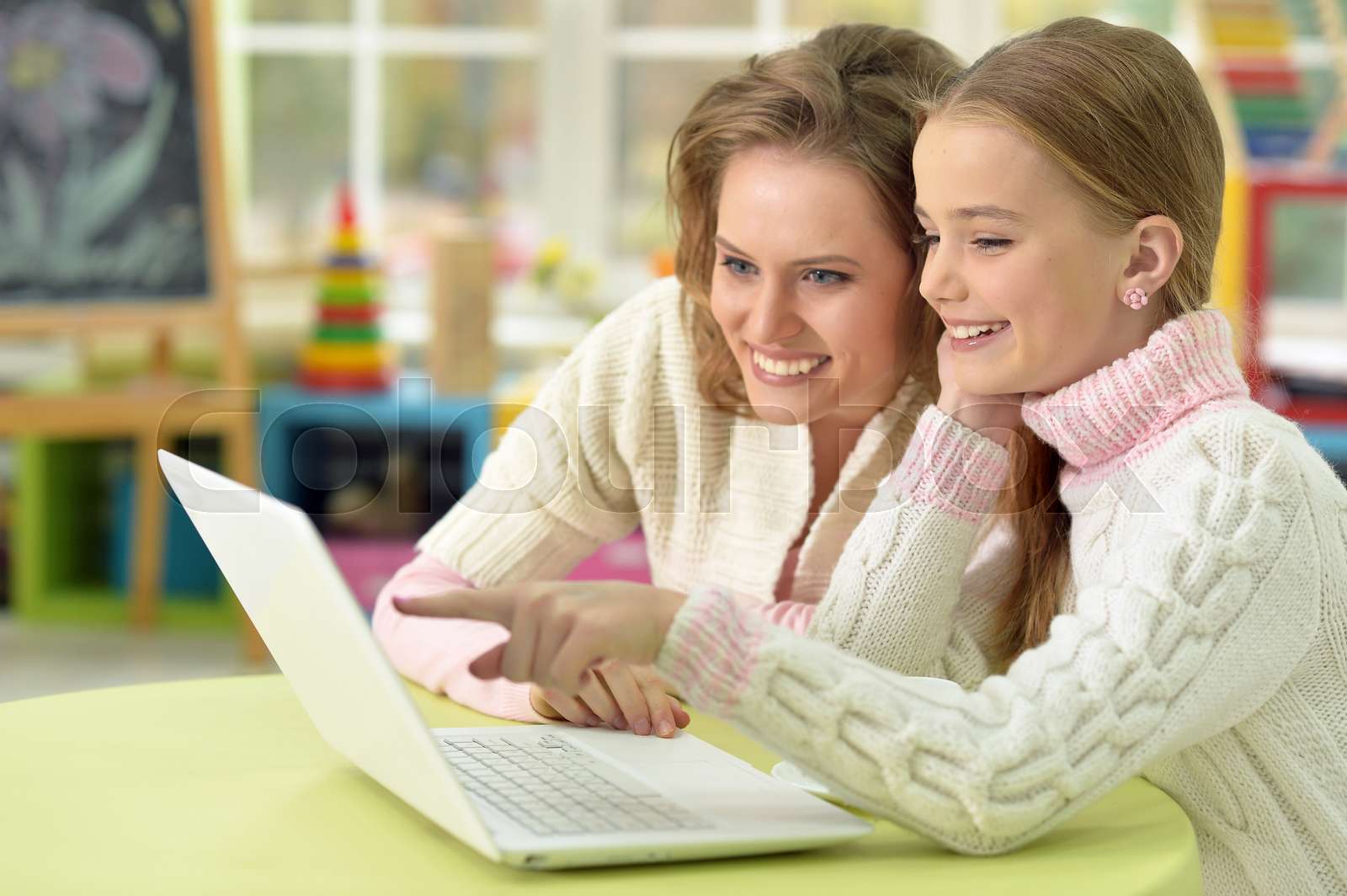 Mother And Daughter With Laptop Stock Image Colourbox