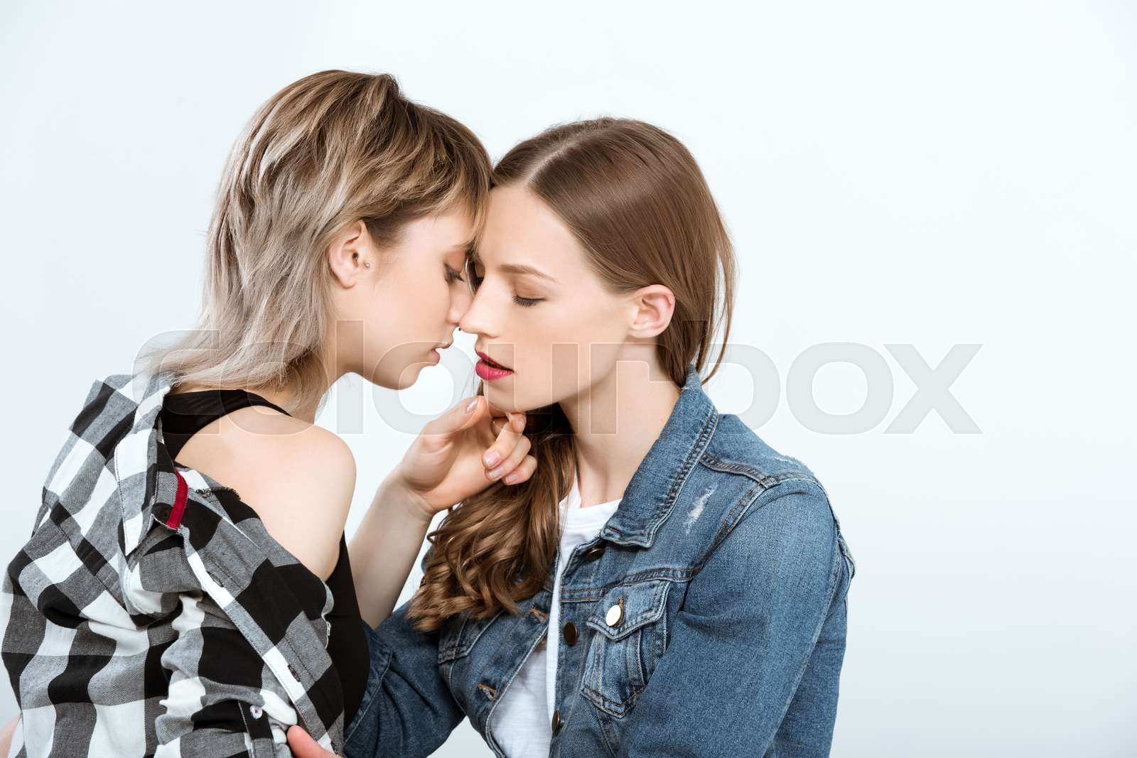 Young Sensual Lesbian Couple Able To Kiss Isolated On Grey Stock