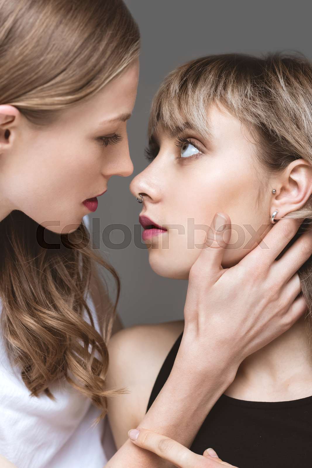 Portrait Of Young Sensual Lesbian Couple Emracing And Looking On Eath