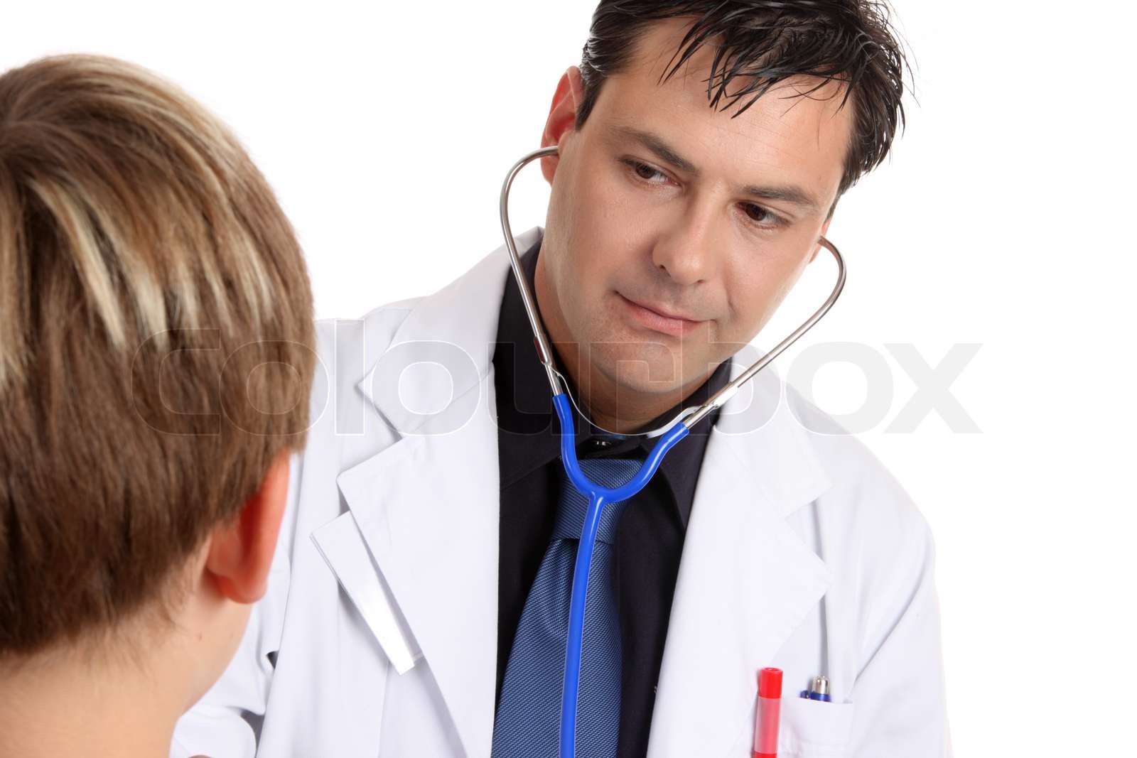 Patient Is Being Examined By A Medical Practitioner Who Is Stock