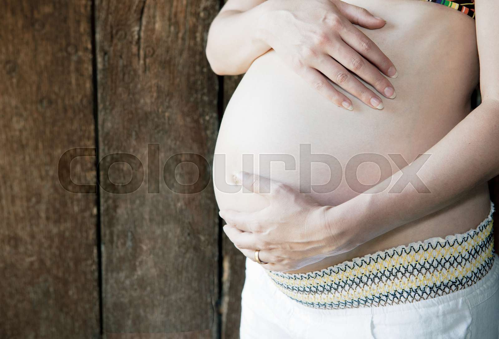 Pregnant Woman Holding Her Belly Stock Image Colourbox