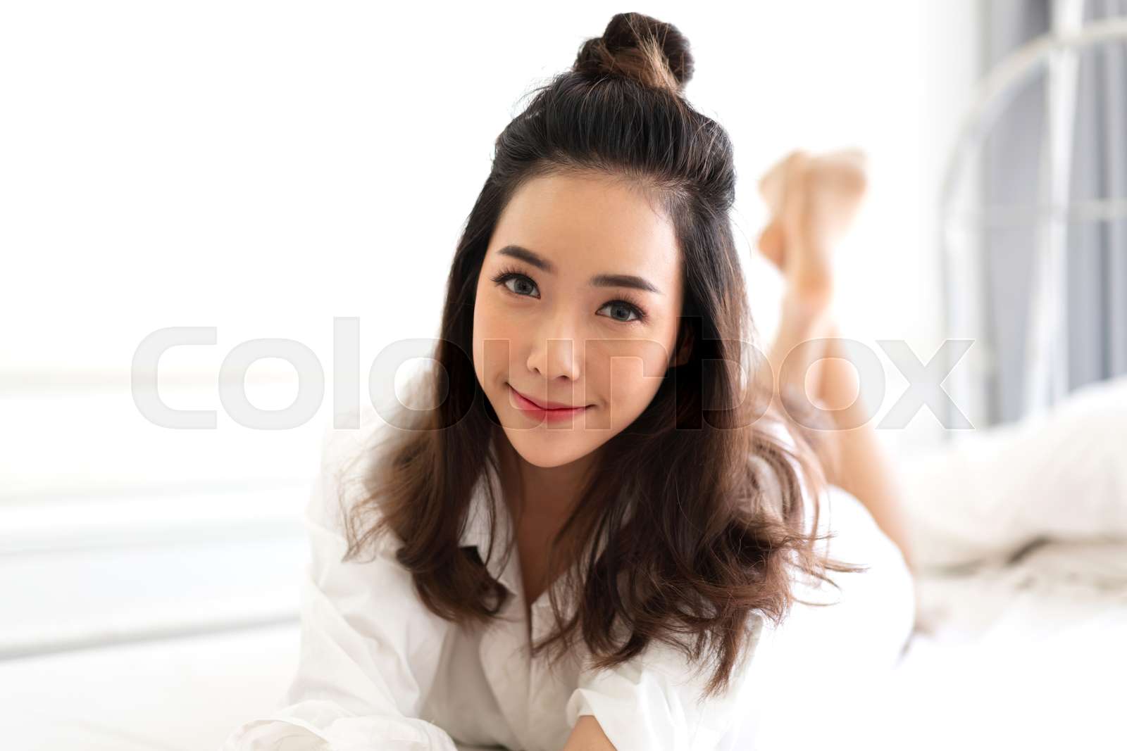 Portrait Of Asia Woman Enjoy And Relax On The Bed In Bedroom At Home