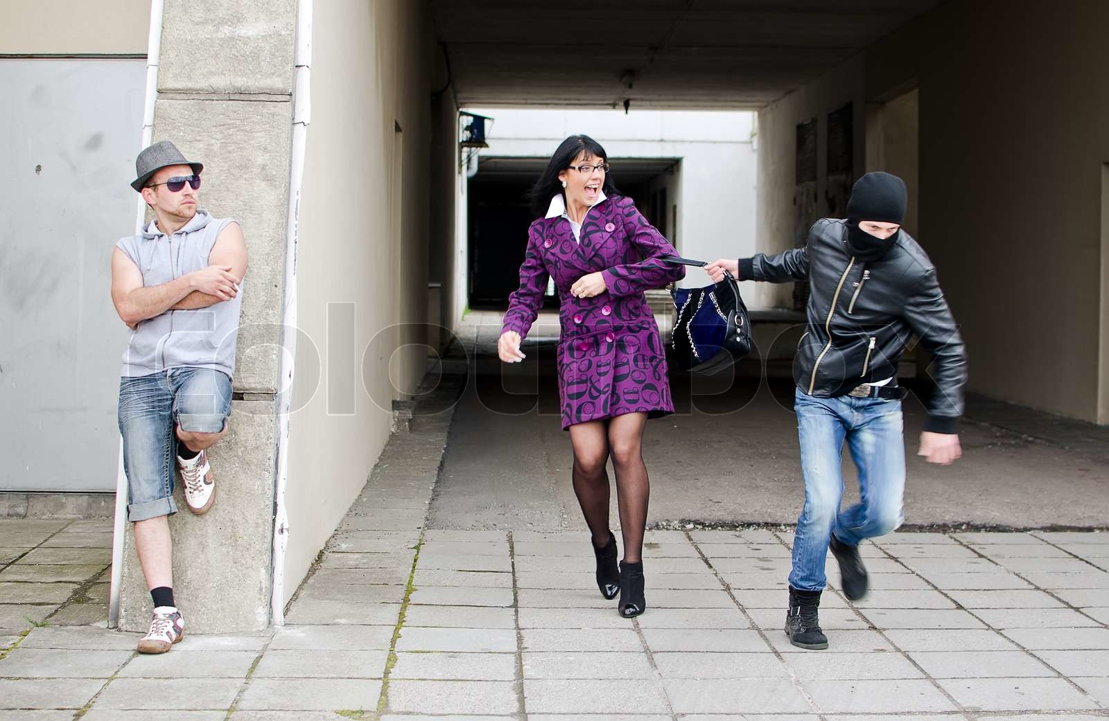 Daylight Robbery On The Street Thief Steals A Bag Stock Image Colourbox