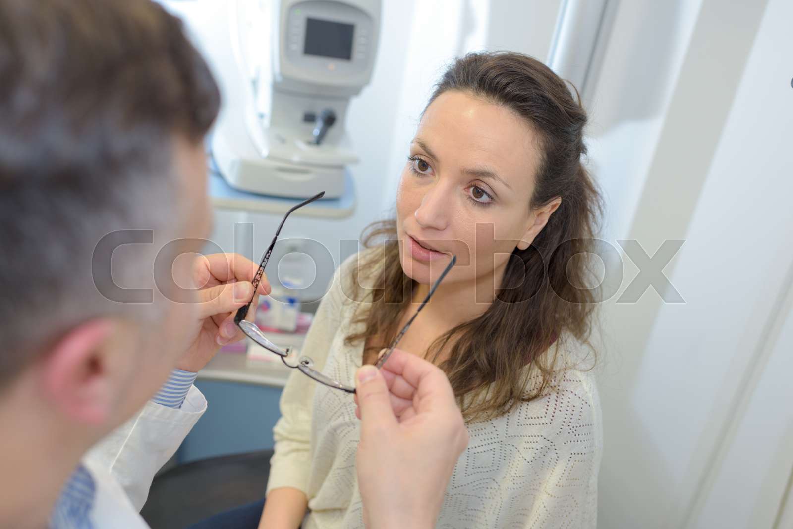 Male Doctor Examining Adult Female Patient Stock Image Colourbox