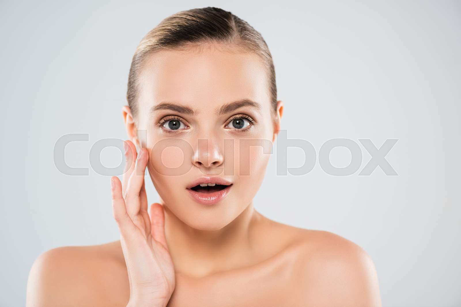 Surprised And Naked Woman Touching Face Isolated On Grey Stock Image