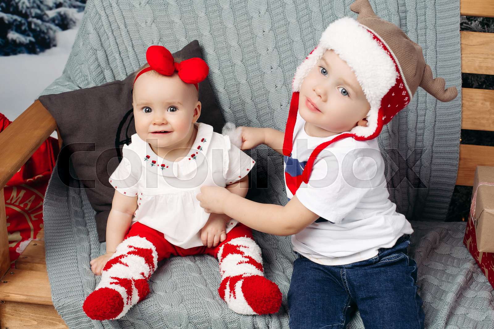 Brother And Sister In Festive Christmas Clothes Stock Image Colourbox
