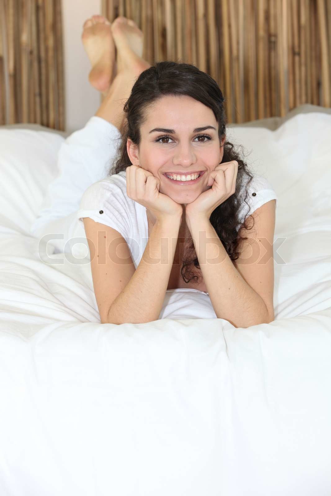 Girl Lying On Her Bed Stock Image Colourbox