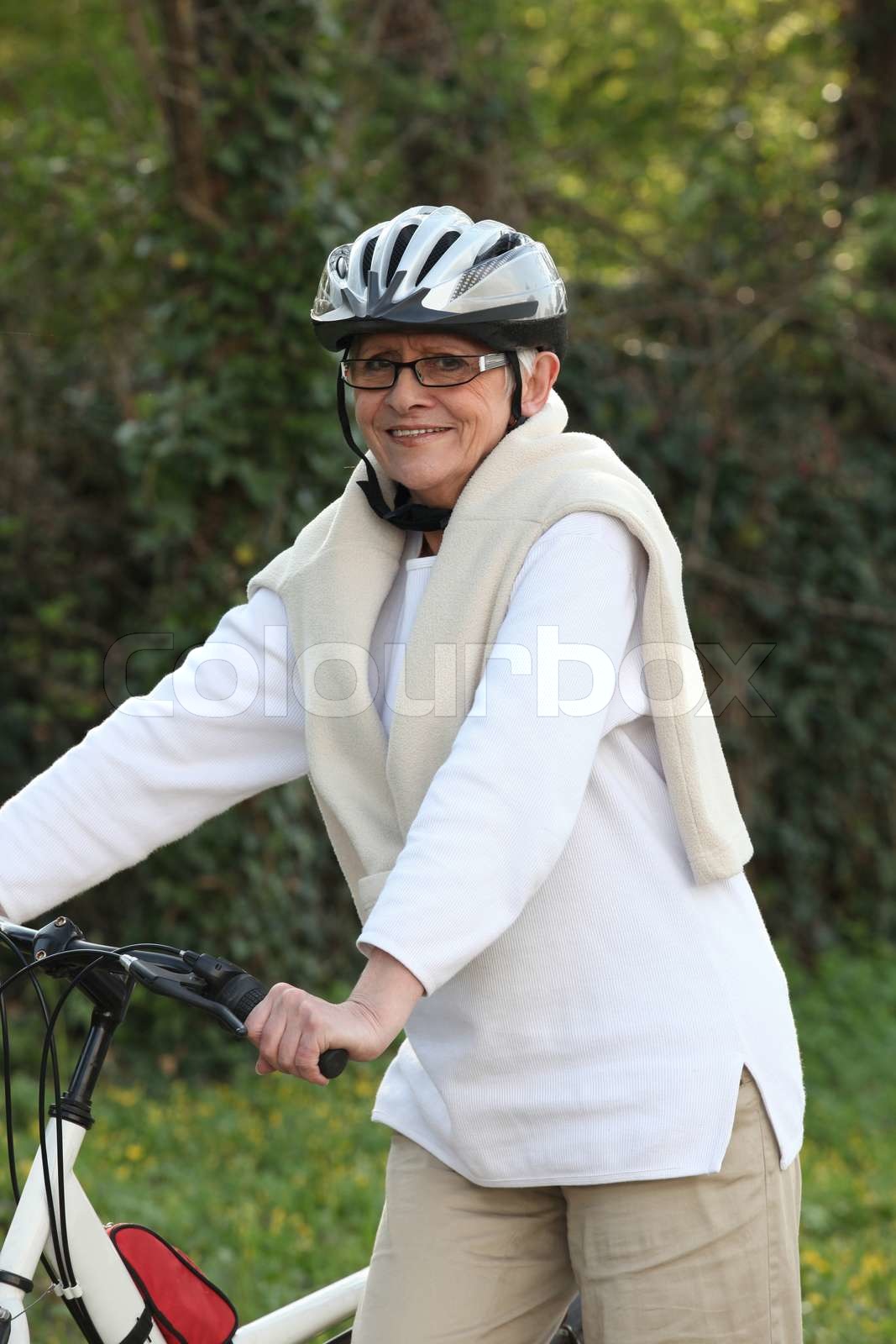 Elderly Woman Riding Her Bike Stock Image Colourbox