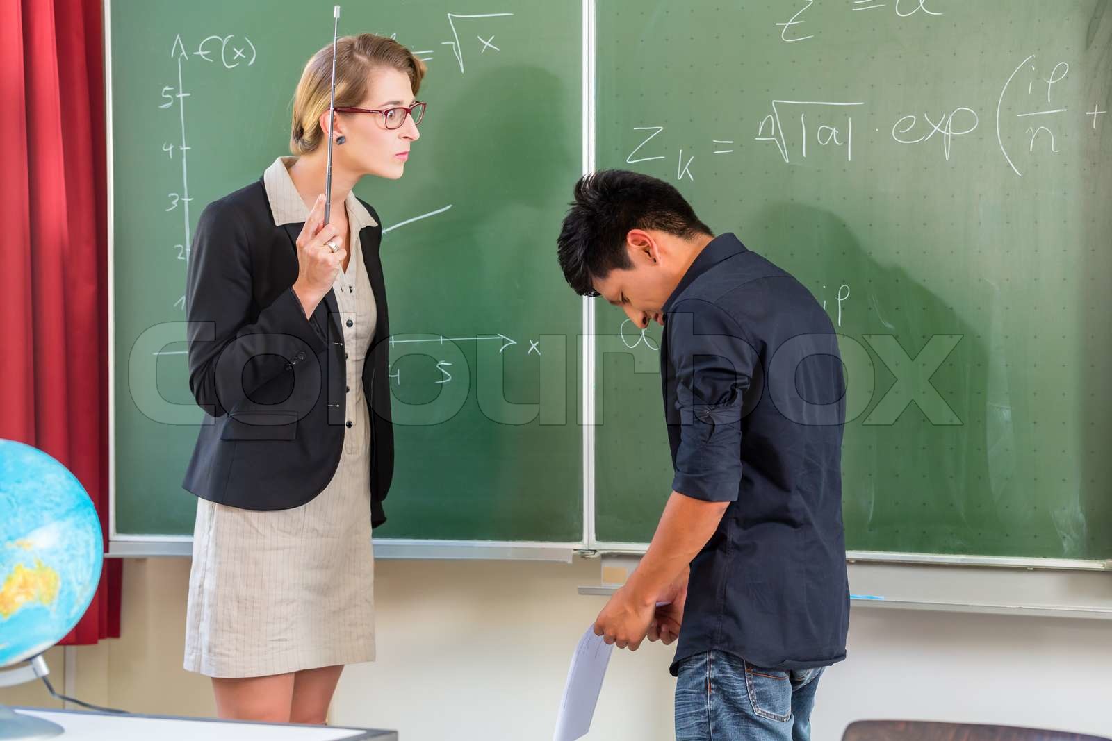 Teacher Criticizing A Pupil In School Class Stock Image Colourbox