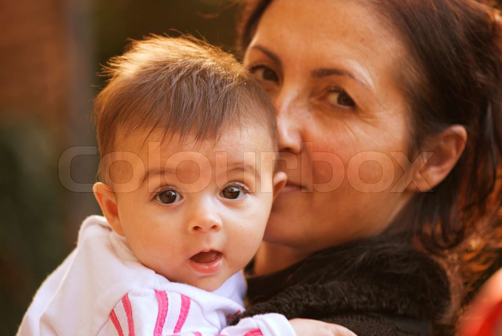 Mother Embracing Her Daughter Stock Image Colourbox