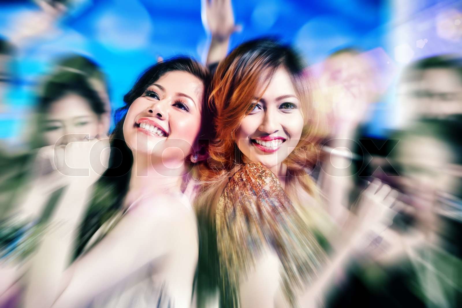 Asian Girls Partying On Dance Floor Of Disco Nightclub Stock Image