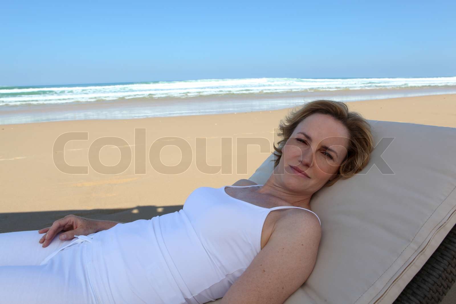 Woman Lying On Sun Lounger Stock Image Colourbox