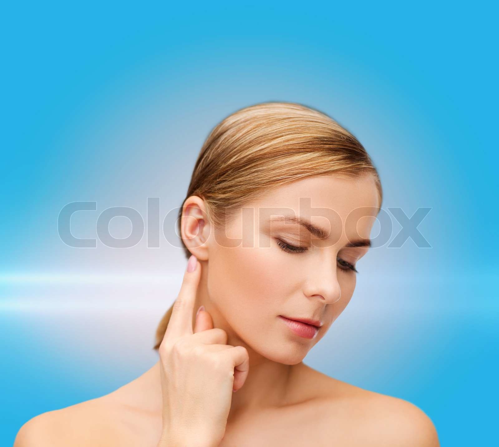 Calm Woman Touching Her Ear Stock Image Colourbox