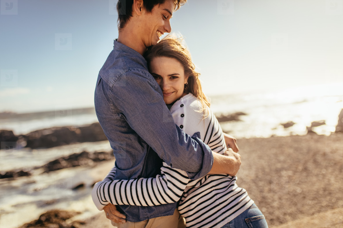 Happy Couple Hugging Each Other Standing At The Beach Photo 152148