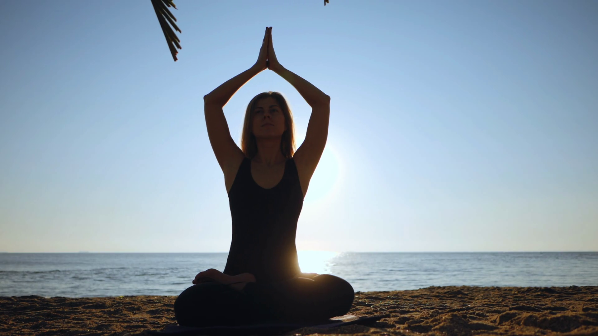 Silhouette Of Beautiful Young Woman Practicing Morning Yoga In Lotus