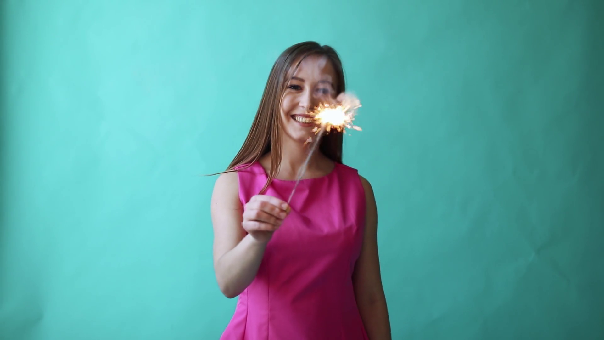 Close Up Of A Beautiful Woman Holding With Sparkler Focus On