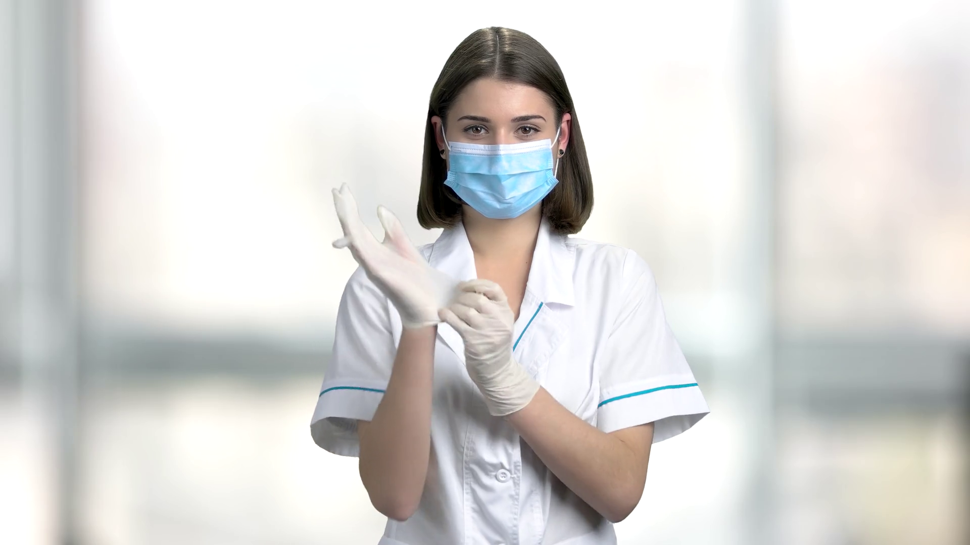 Lady Doctor Putting On Protective Gloves Beautiful Female Doctor In