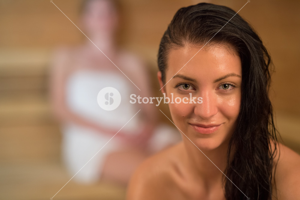 Closeup Of Smiling Sweaty Woman In The Sauna Royalty Free Stock Image