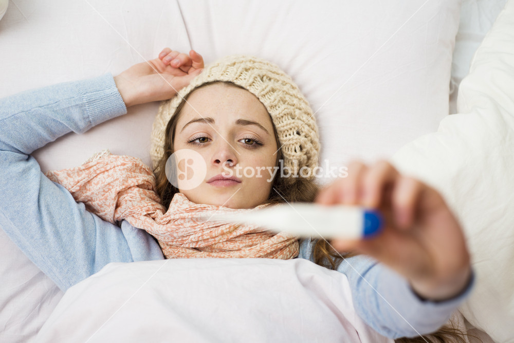 Sick Woman With Thermometer Is Lying In Bed She Has Cold Flu And High