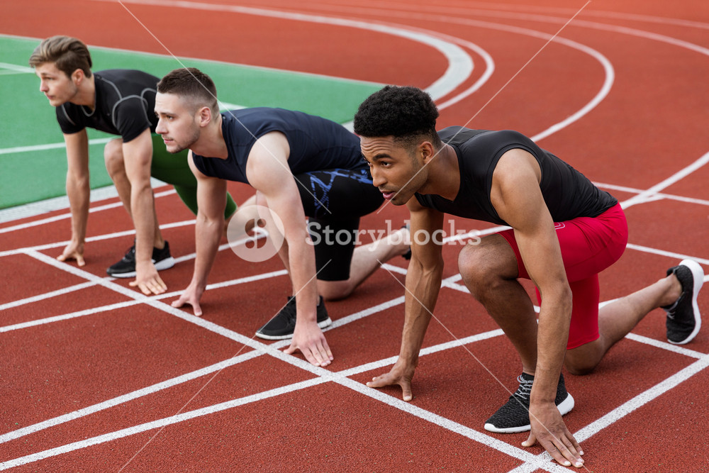 Image Of Multiethnic Athlete Group Ready To Run On Running Track