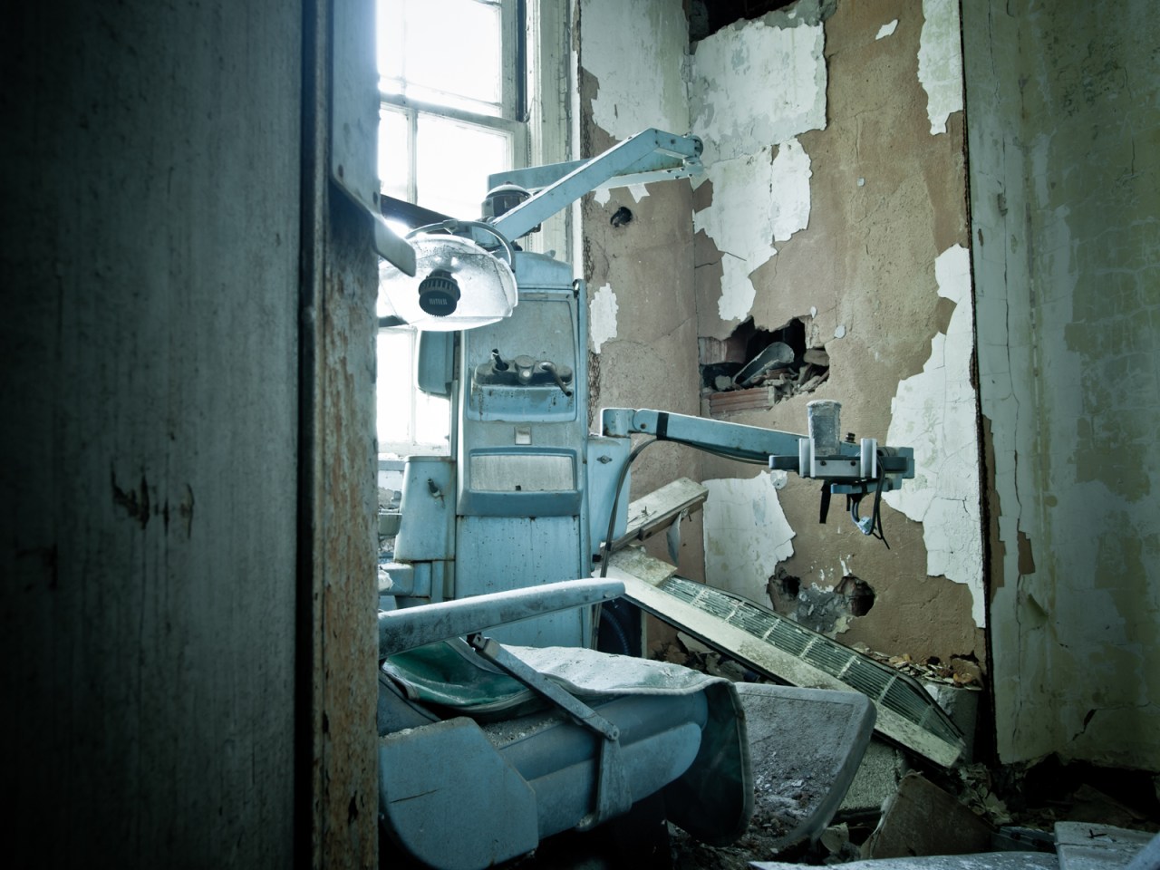 A Dark And Deserted Asylum Sits Quietly Falling To Pieces