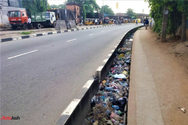 Open And Dirty Drainage Beside Horrific Road Traffic Lagos State Is