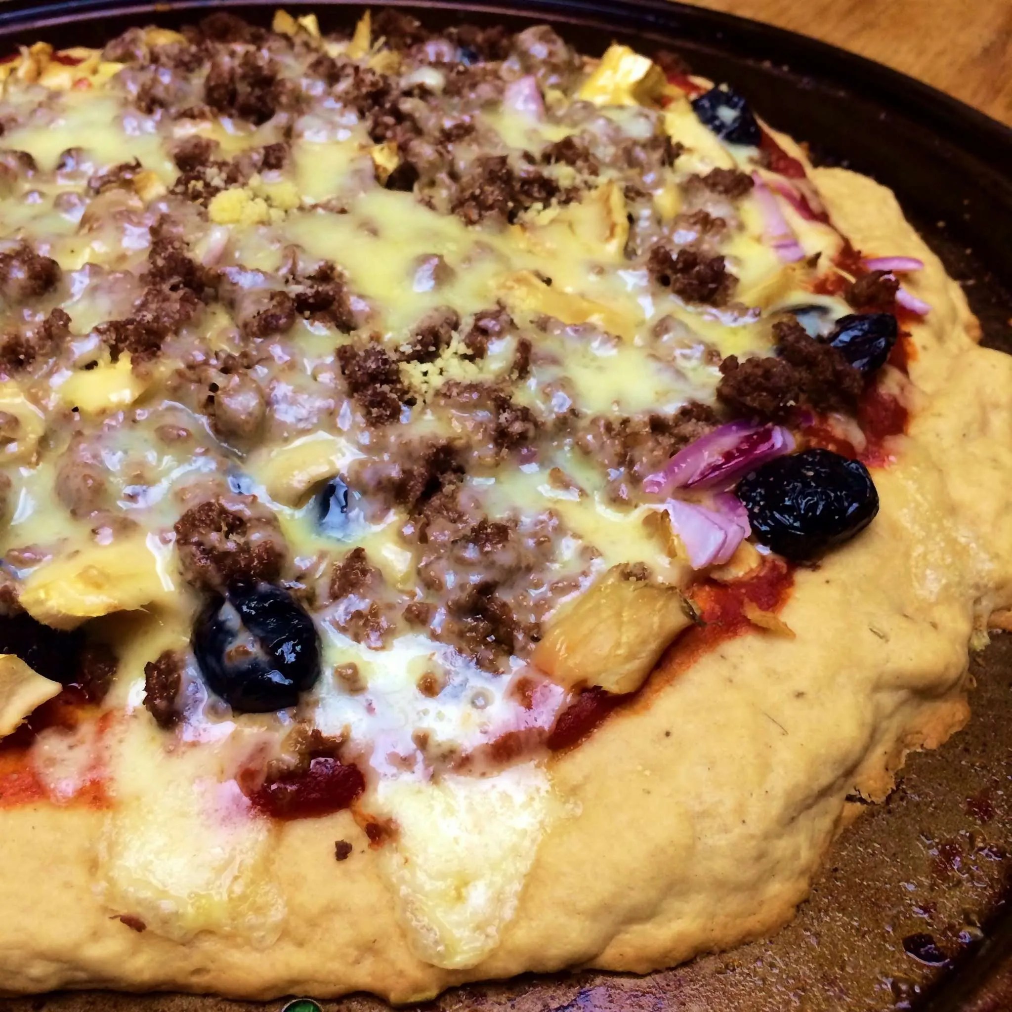 Wild Pork Sausage Black Olive And Mushroom Pizza With Homemade