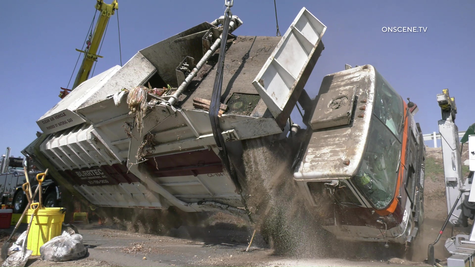 Garbage Truck Rolls Down Embankment Off The Freeway Riverside