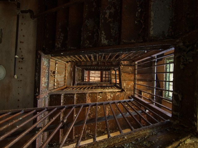 A Dark And Deserted Asylum Sits Quietly Falling To Pieces