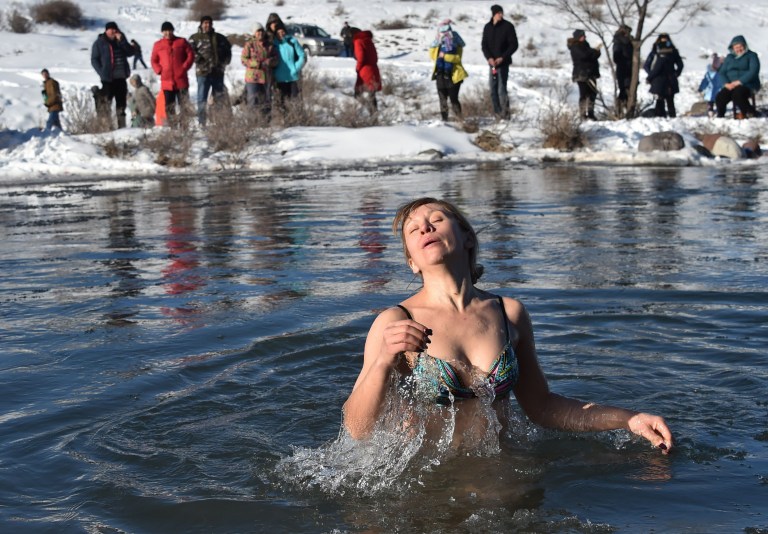 Orthodox Christians Plunge Into Freezing Ice Baths For Epiphany Metro