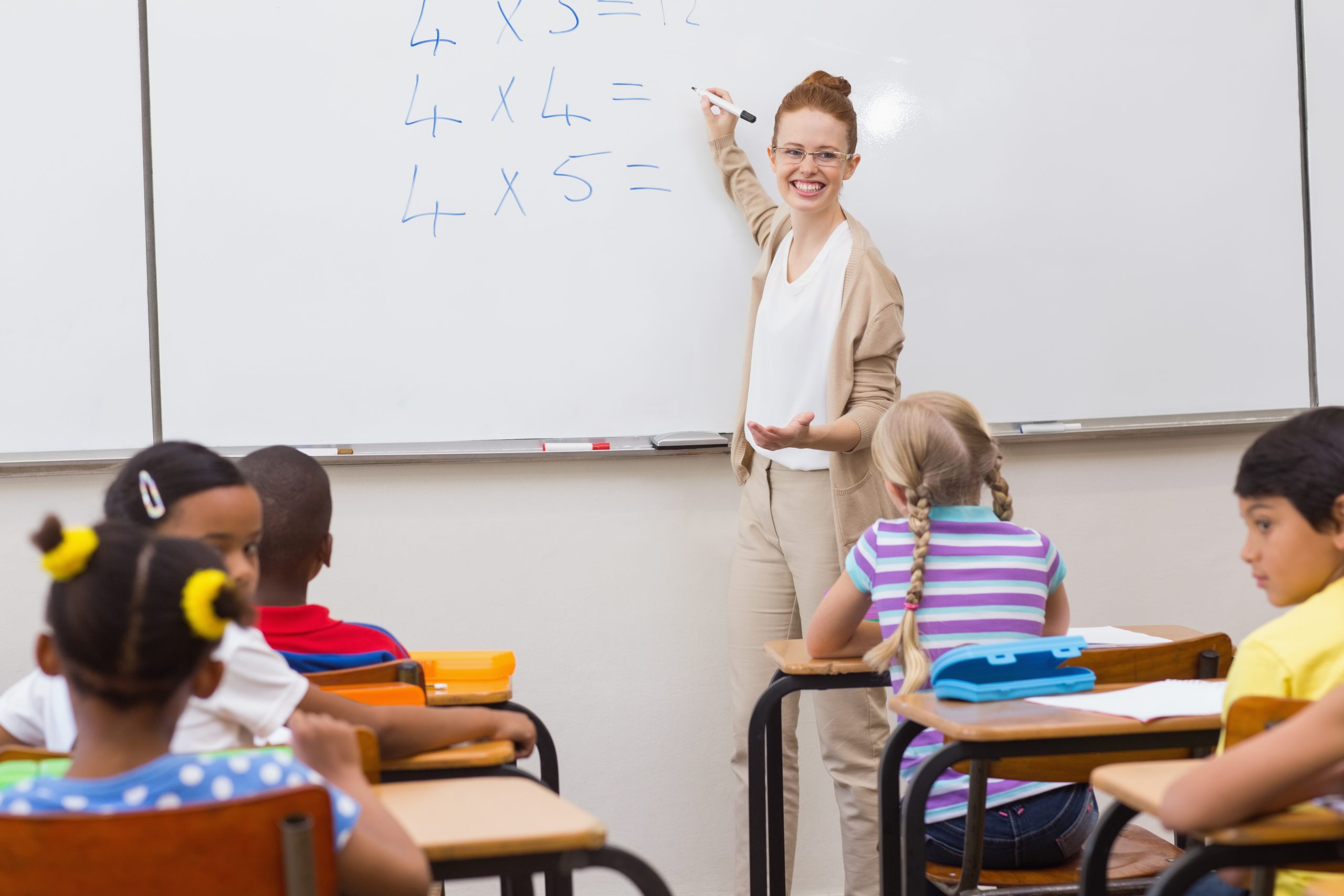 Teacher Giving A Lesson In Classroom At The Elementary School