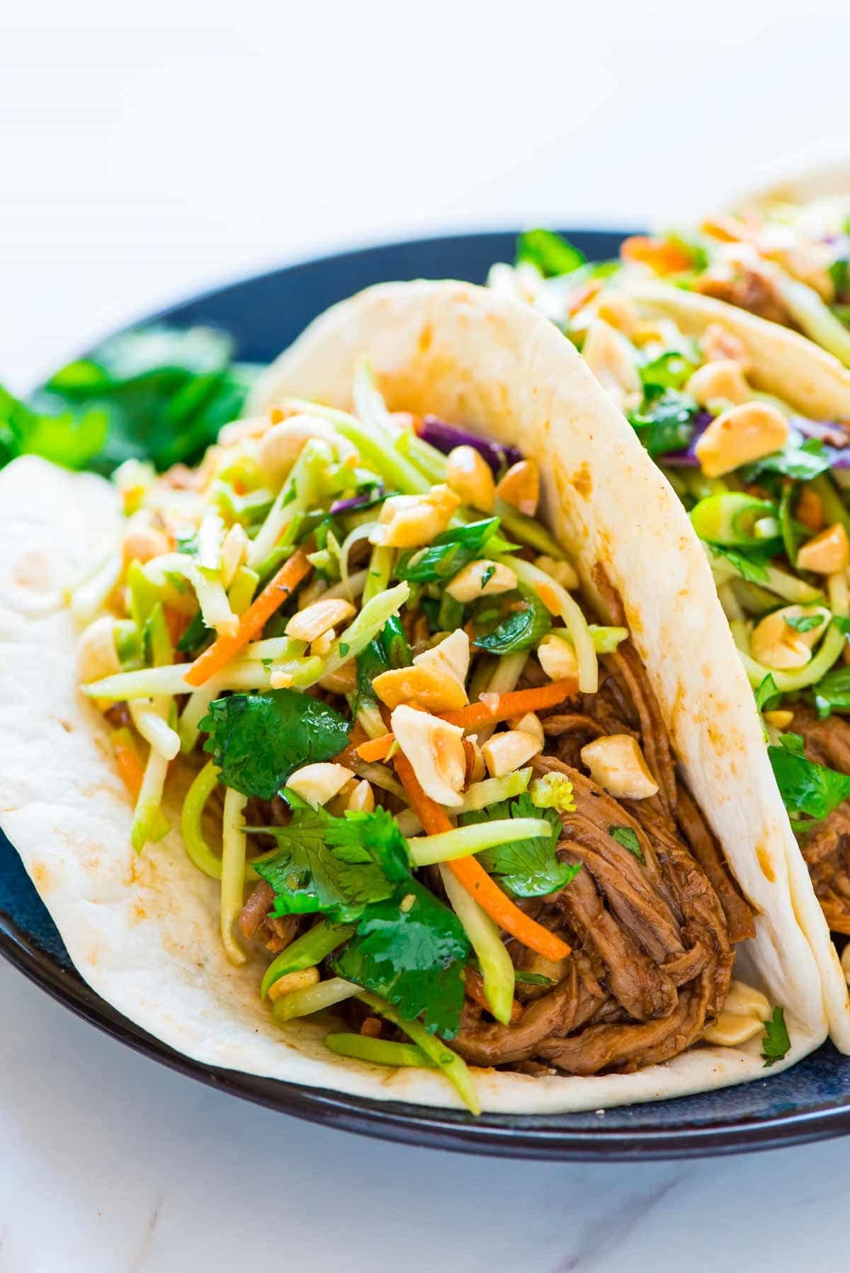 Asian Pulled Pork Tacos With Peanut Broccoli Slaw Slow Cooker Pork Recipe