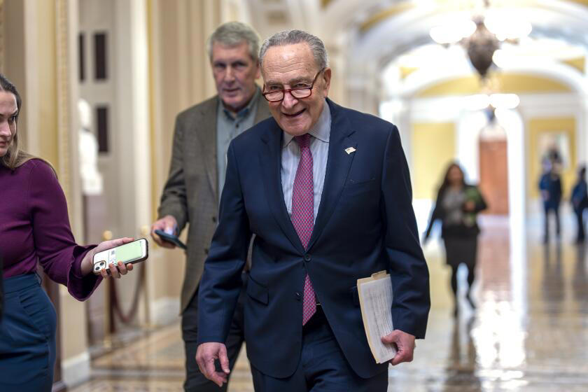 Biden Signs A Package Of Spending Bills Passed By Congress Just Hours